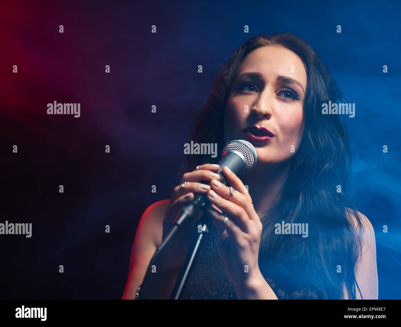 Woman on stage with microphone hi-res stock photography and images - Alamy