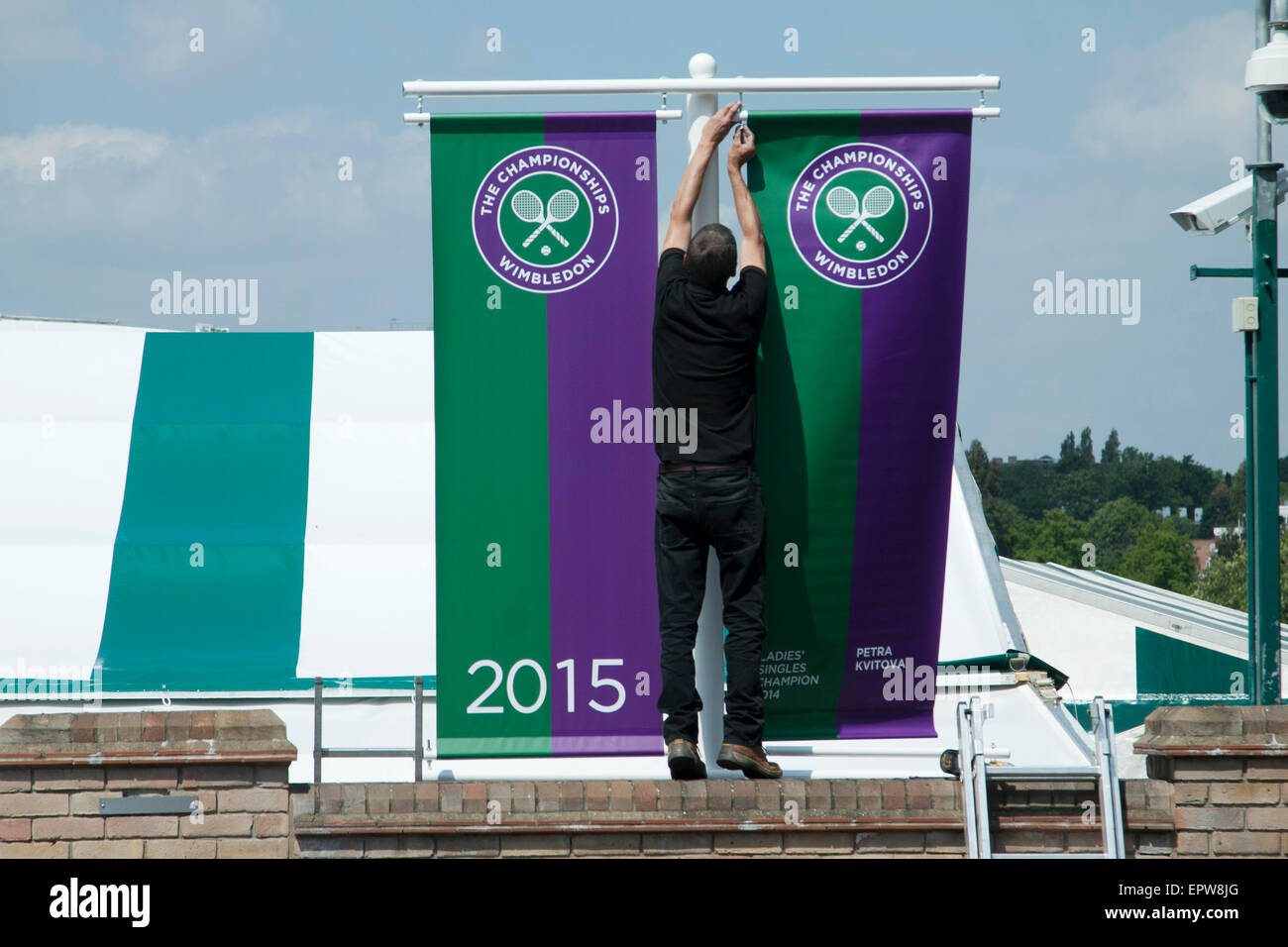 Wimbledon London,UK. 21st May 2015. Workers unveil the 2014 Wimbledon ...