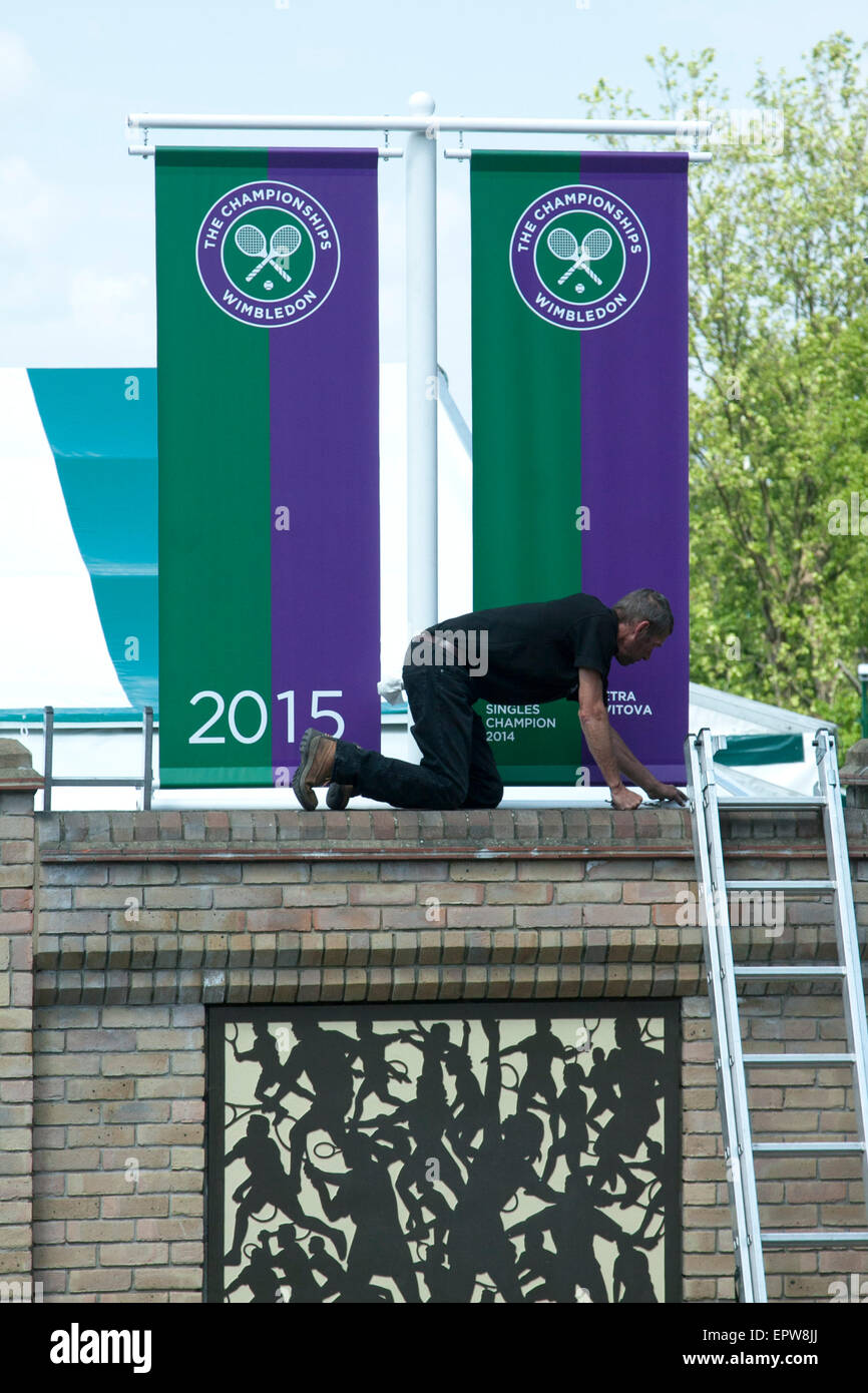Wimbledon London,UK. 21st May 2015. Workers unveil the 2014 Wimbledon ...
