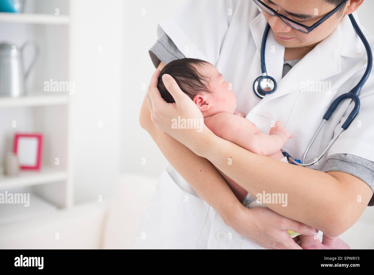 Good looking asian doctor and newborn baby on the clinic Stock Photo ...