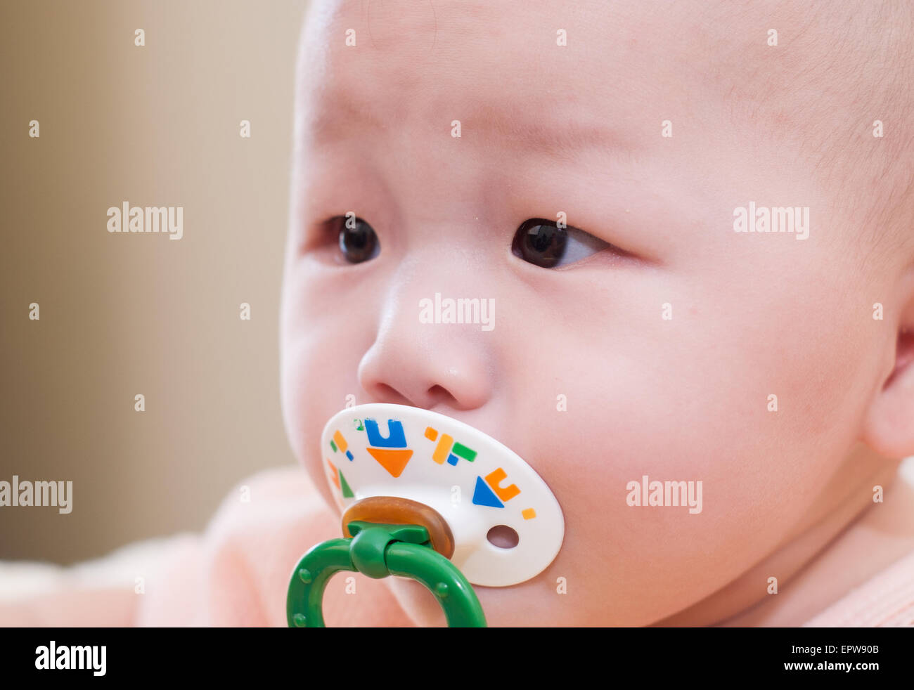 asian baby with a pacifier Stock Photo - Alamy