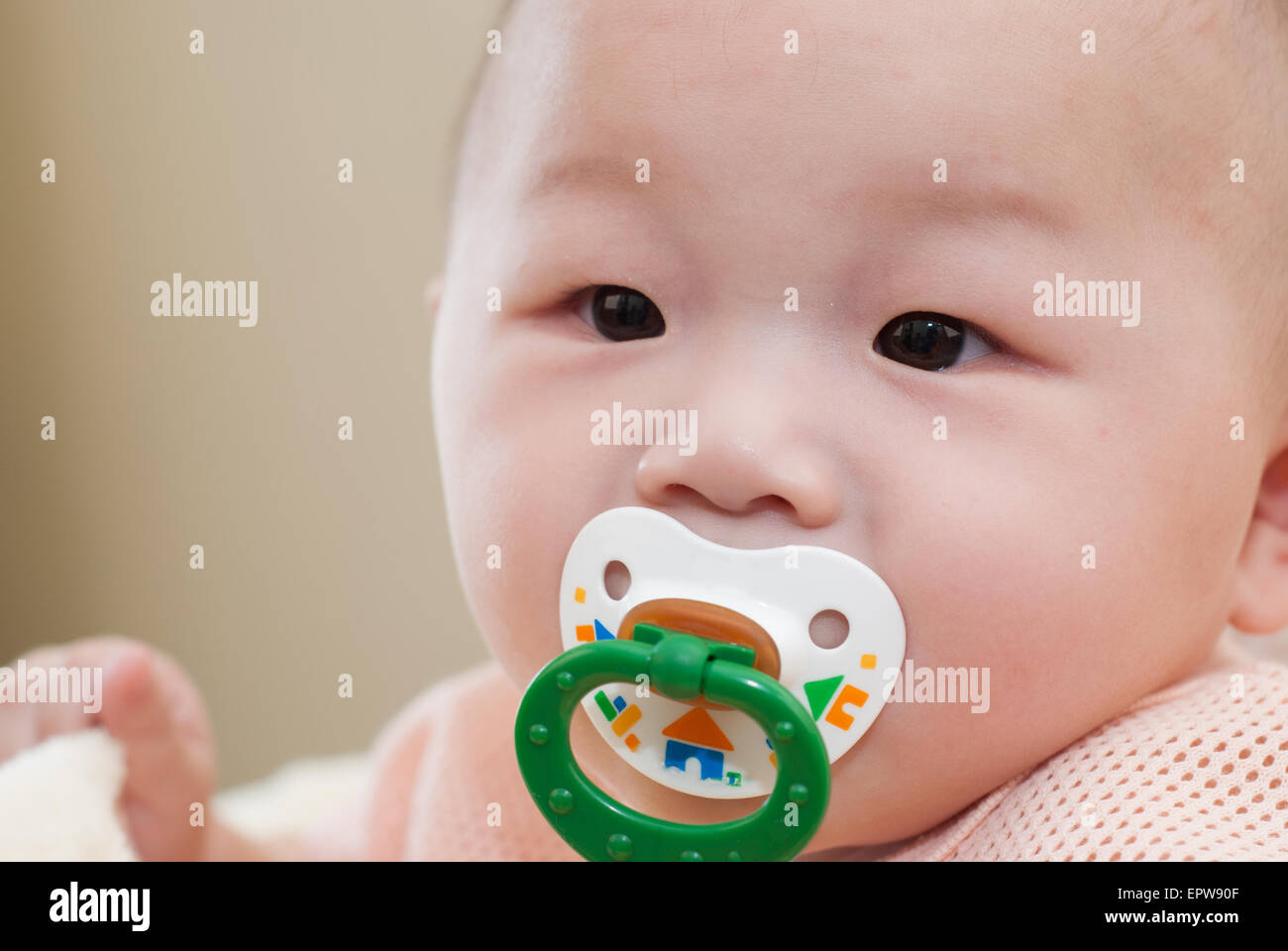 asian baby with a pacifier Stock Photo - Alamy