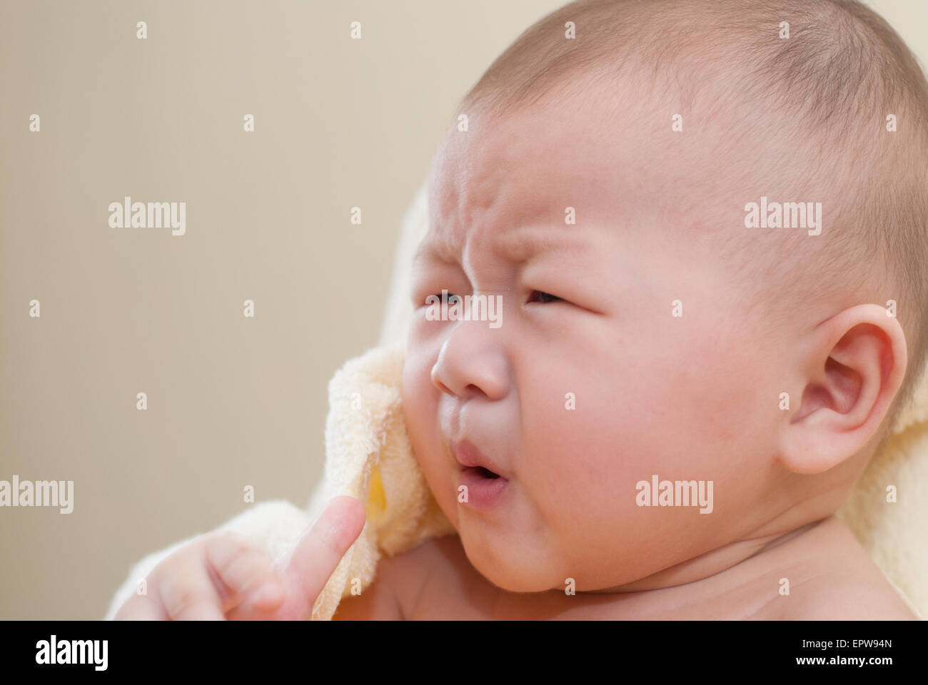 A cute little asian baby with surprise expression Stock Photo - Alamy