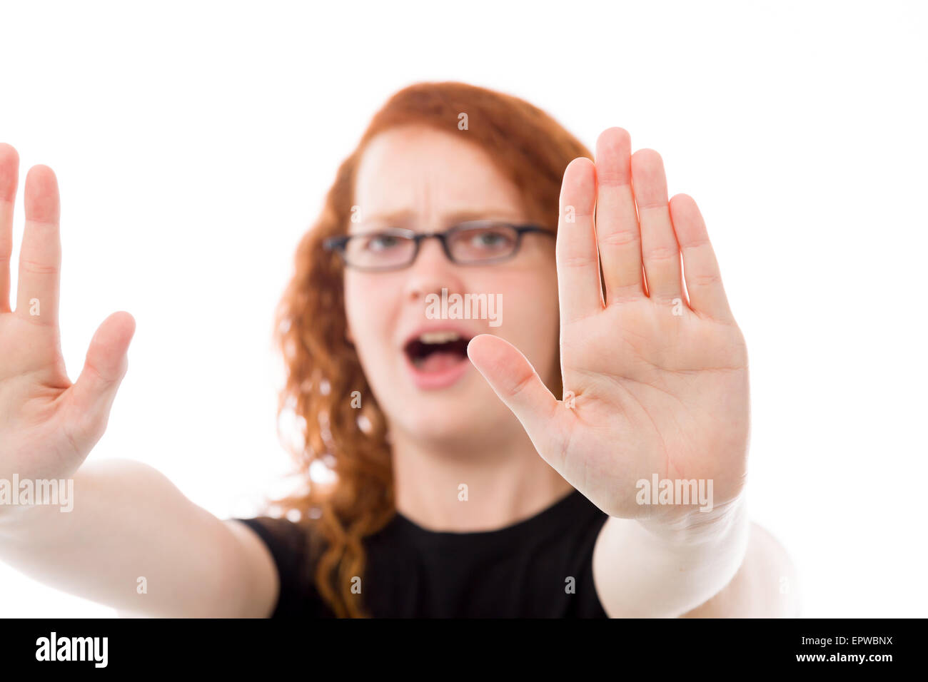 model isolated on plain background stop sign with hands Stock Photo - Alamy