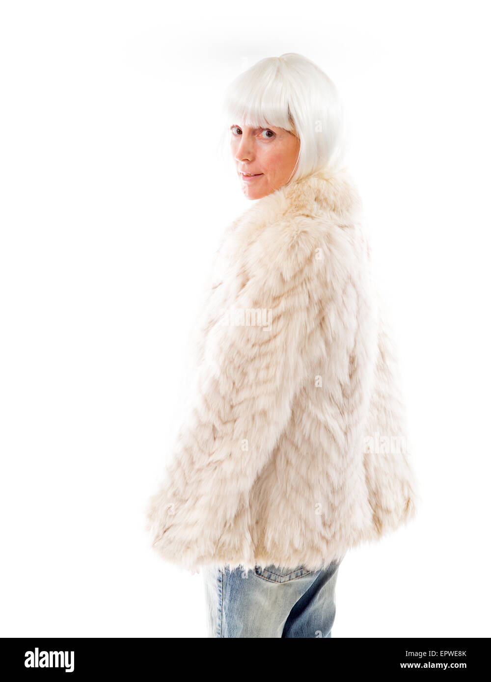 Senior woman looking over shoulder Stock Photo - Alamy