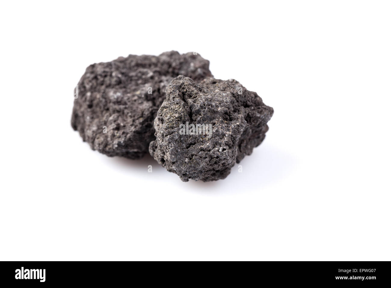 Black lava rock from volcano on a white background Stock Photo - Alamy