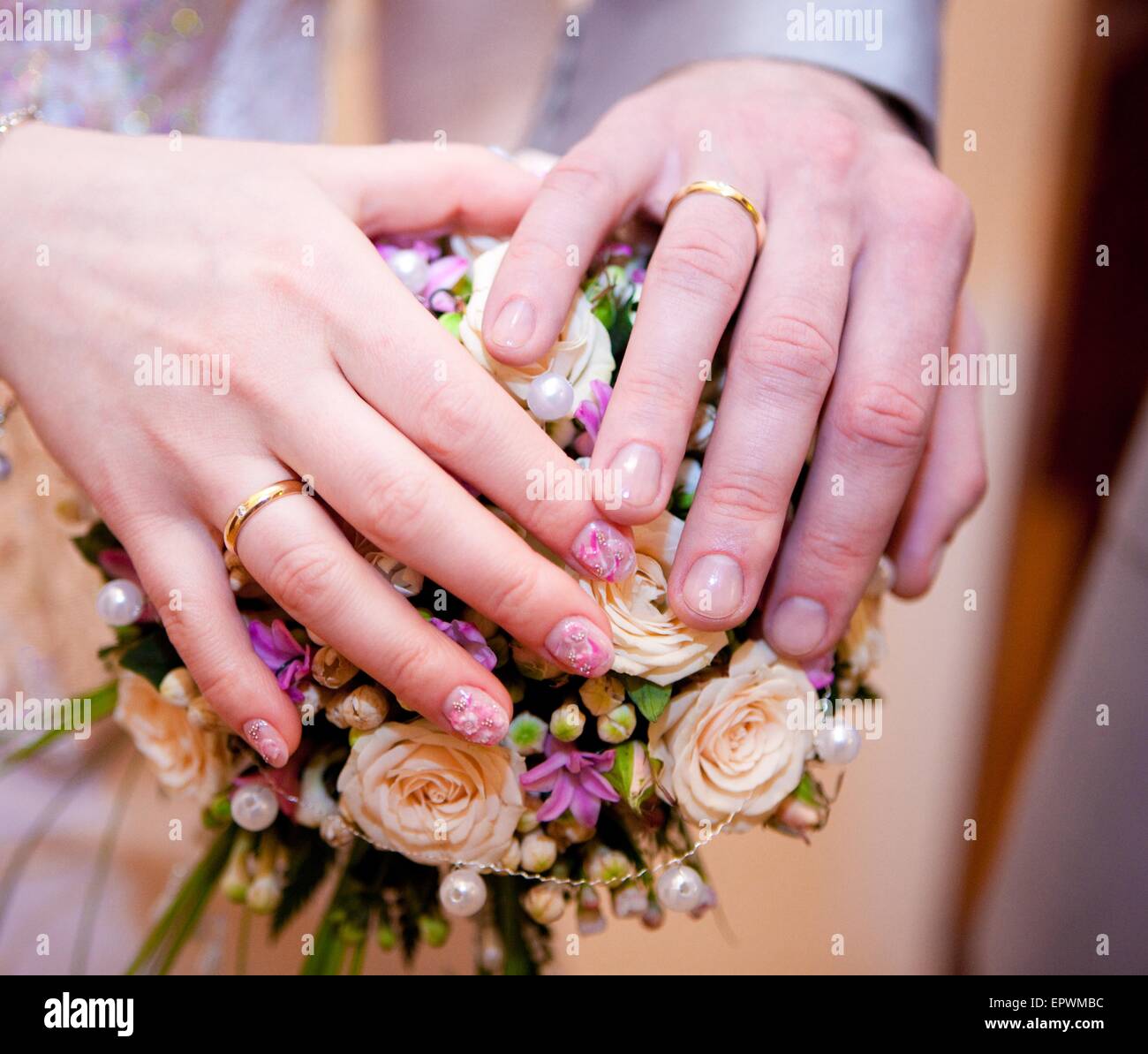 the palms of the bride and groom. wedding rings Stock Photo - Alamy