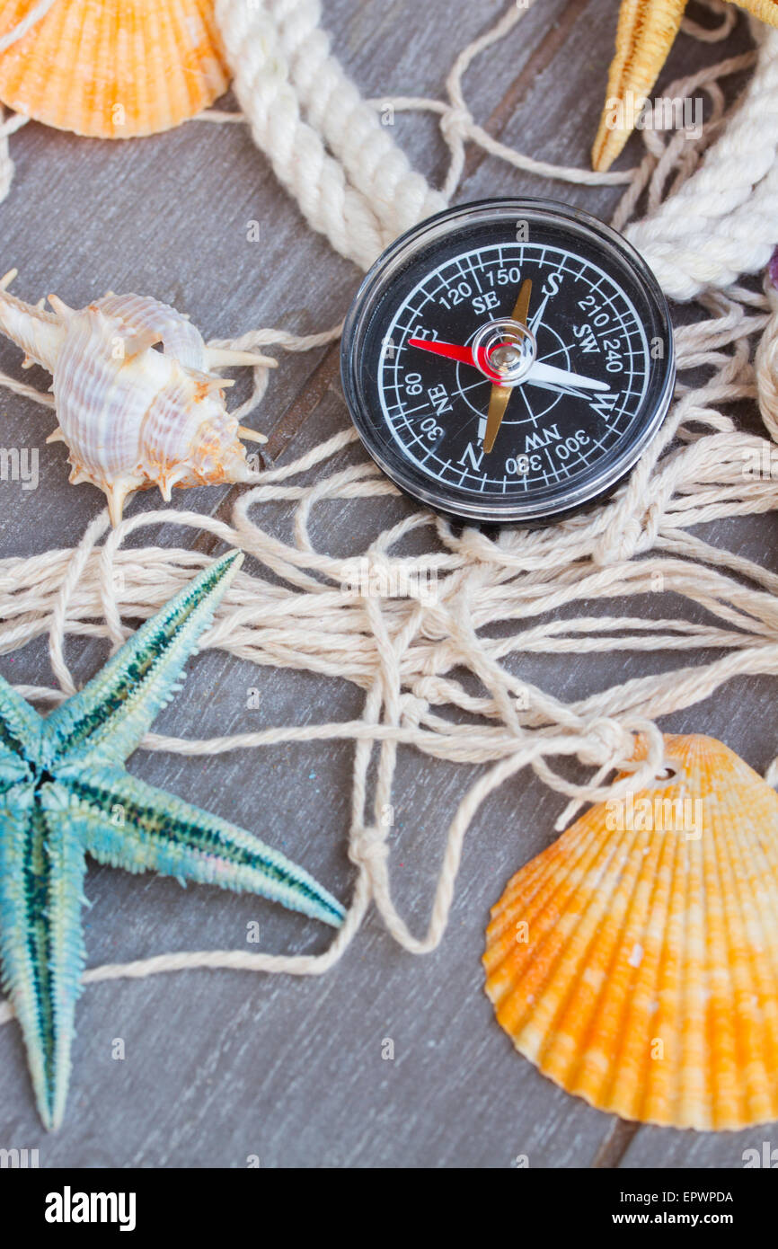 compass on fishing net with tag Stock Photo - Alamy