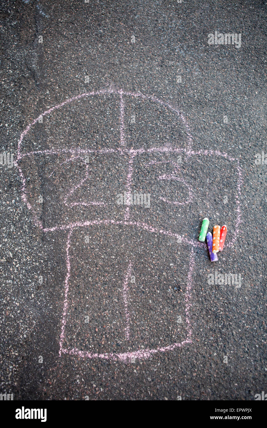 Hopscotch on the ground with colorful street chalk Stock Photo - Alamy