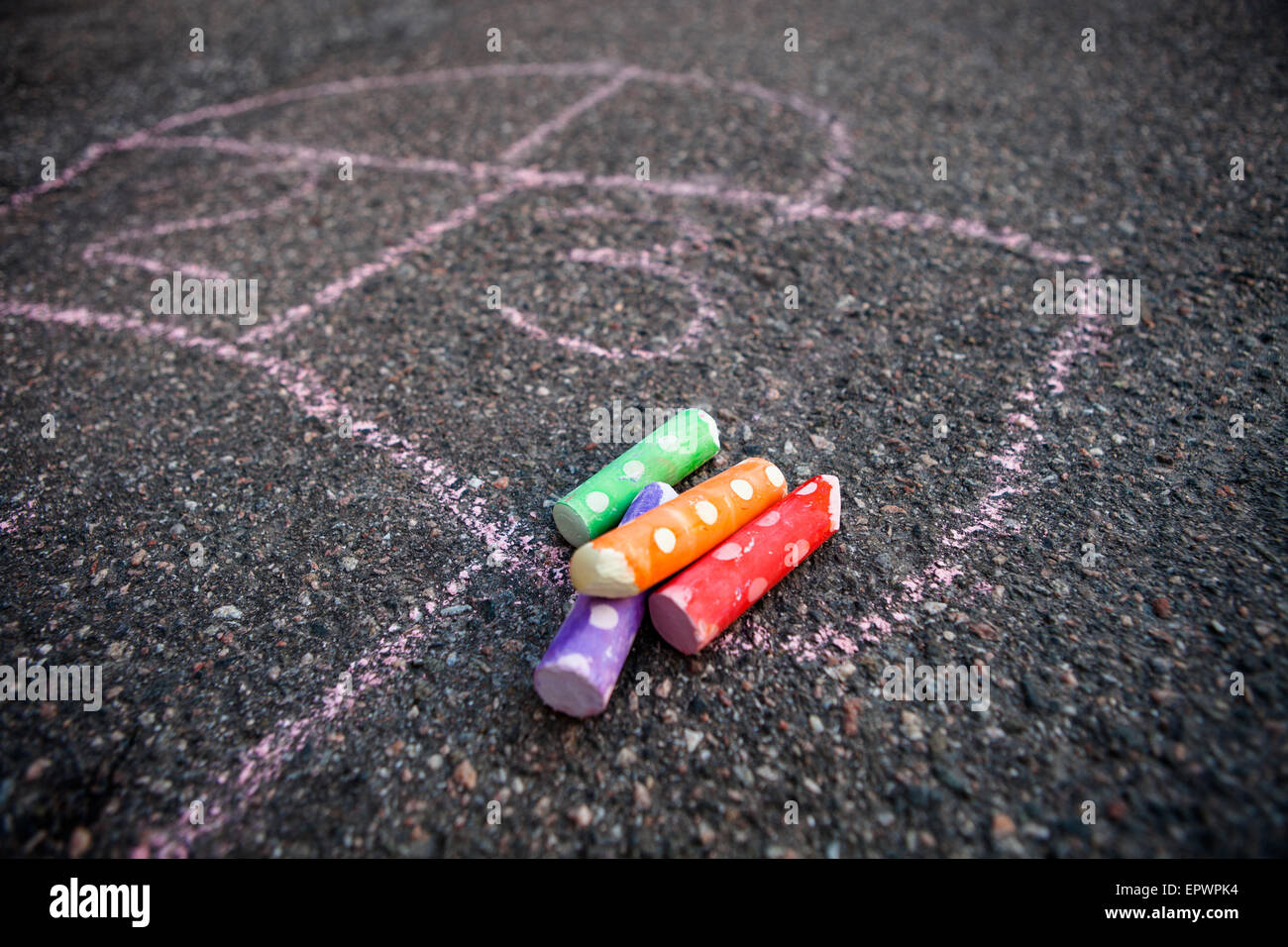 Hopscotch drawn to asphalt with colorful street chalk Stock Photo - Alamy