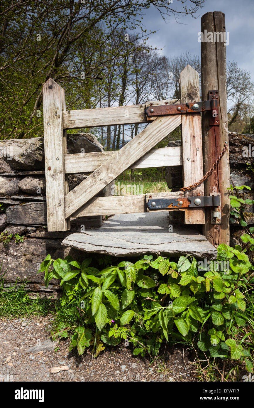 Small gate on top of a stone stile at a junction of the Cumbria Way ...