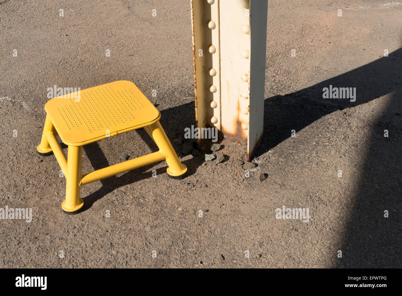 Yellow step stool at rail road depot Stock Photo - Alamy