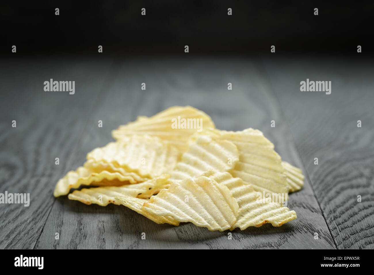 rippled organic chips on wooden table Stock Photo - Alamy