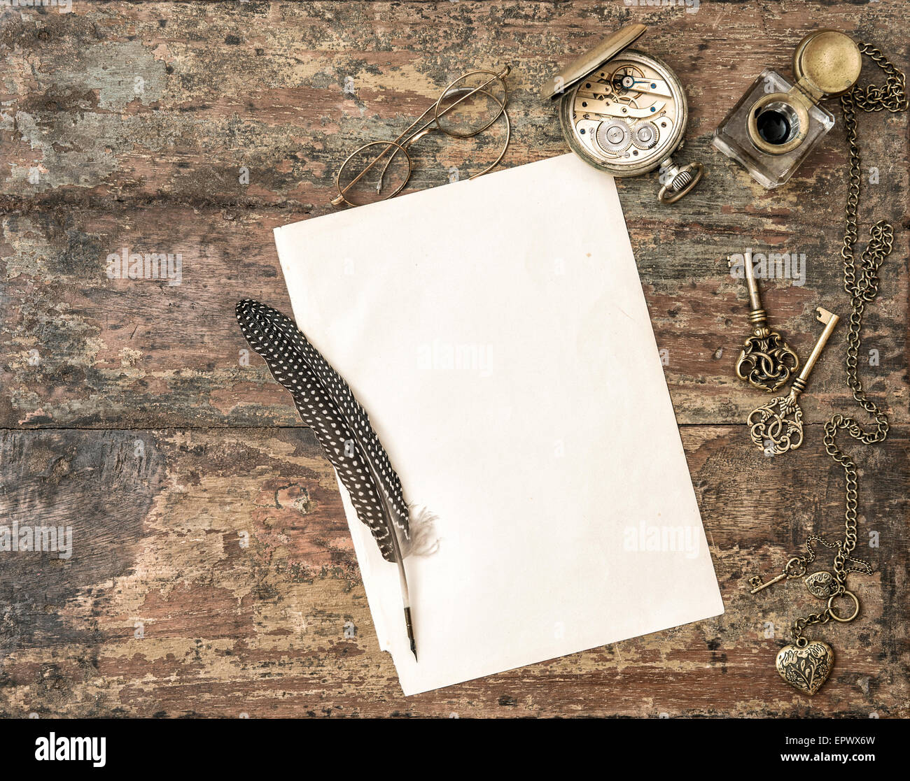 Open book and antoque writing accessories. Feather pen and inkwell on ...