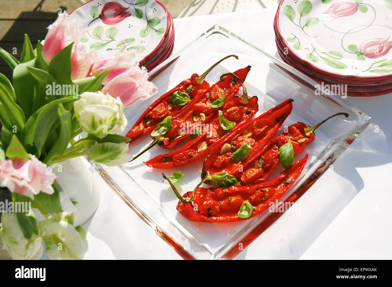 Pepper dish set on an alfresco dining table Stock Photo - Alamy