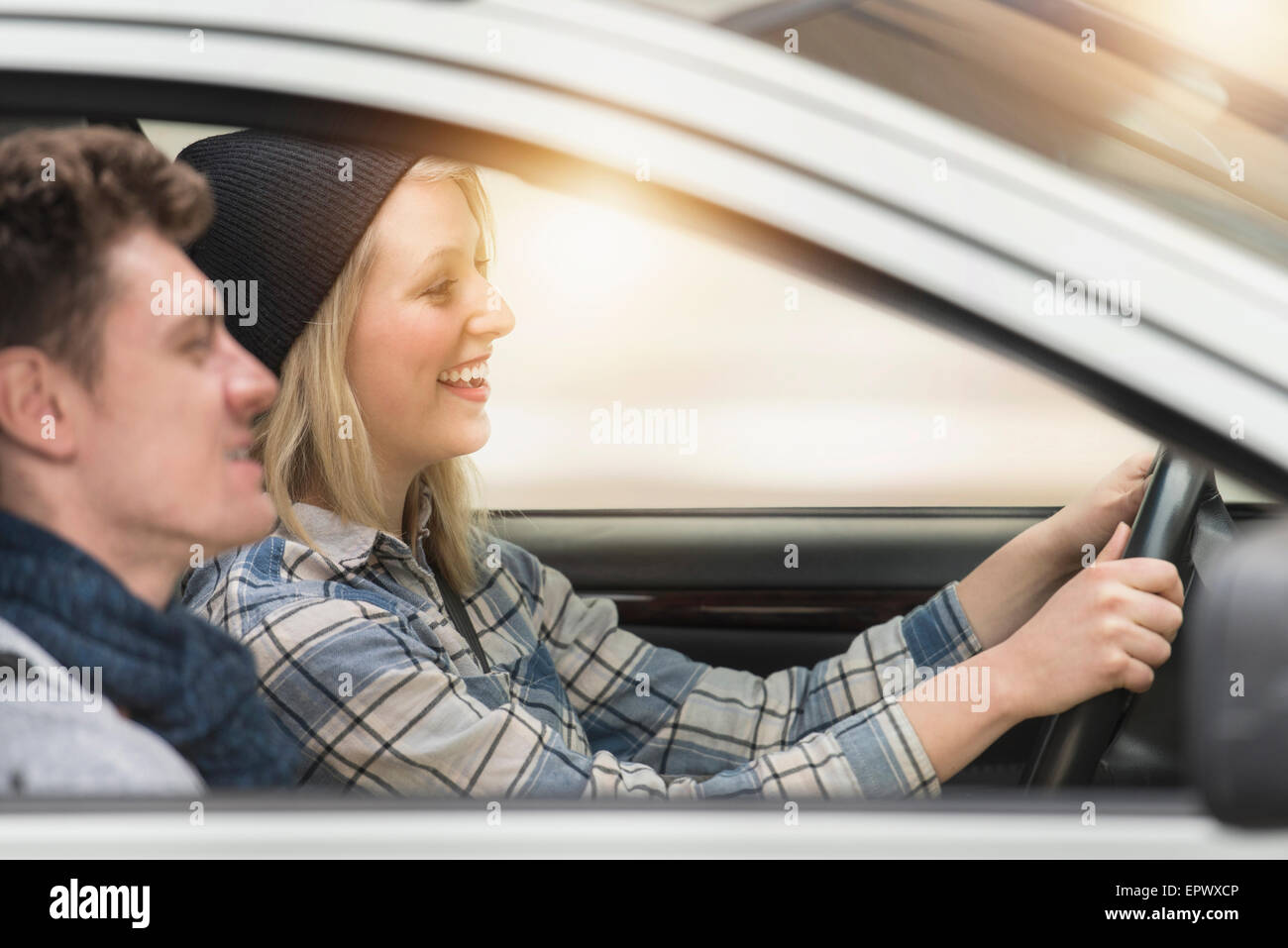 Couple driving car Stock Photo - Alamy