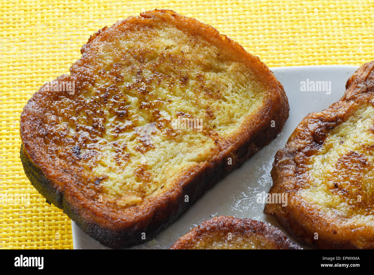 Spanish Torrijas on yellow background Stock Photo - Alamy