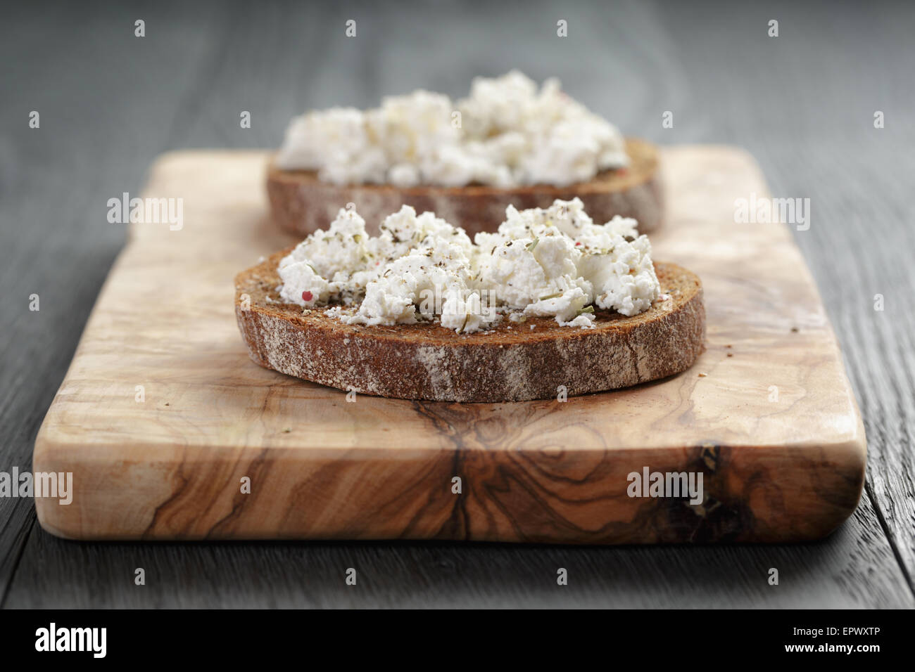 rye sandwich or bruschetta with ricotta cheese and herbs Stock Photo ...
