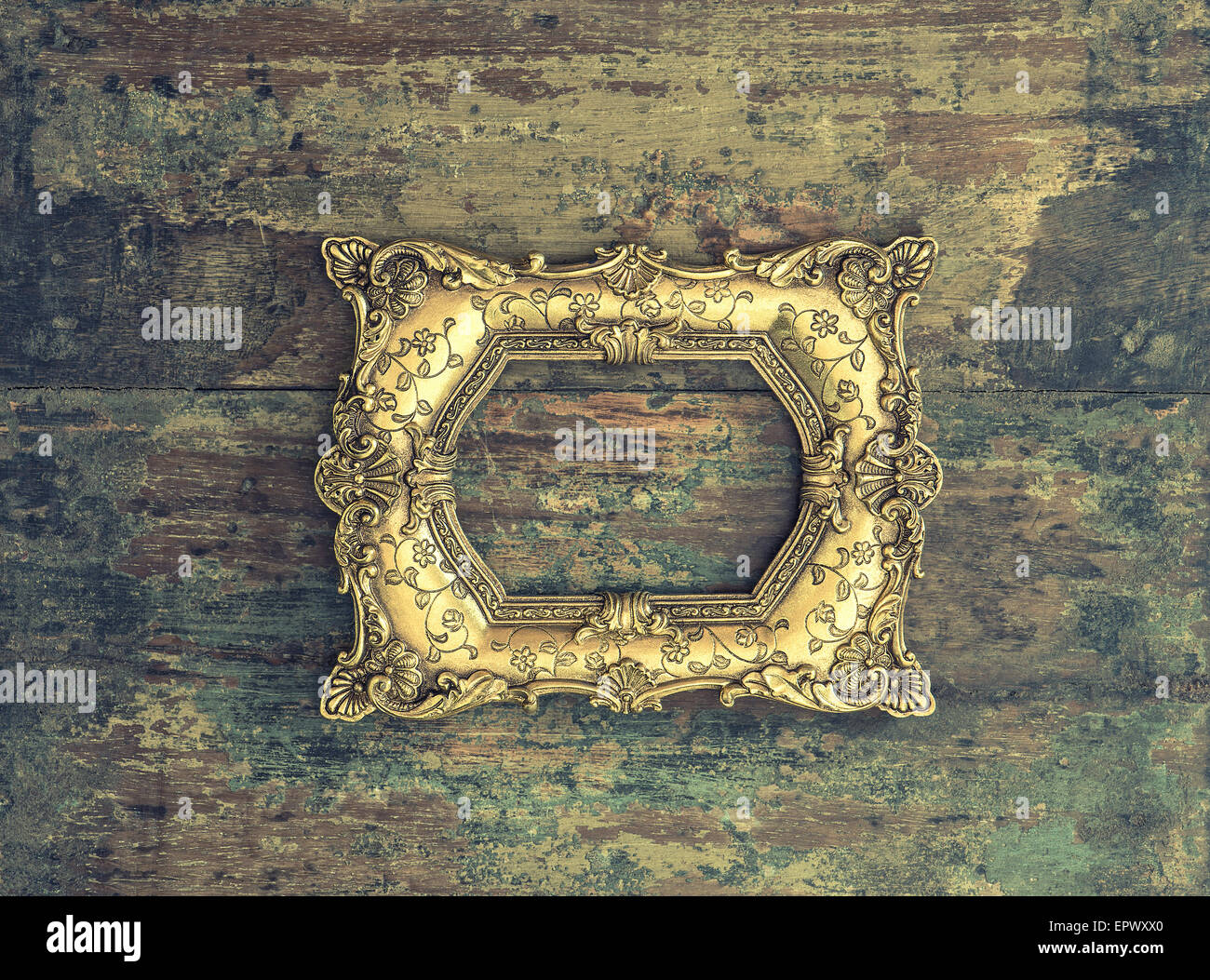 Baroque golden frame over rustic wooden background. Grunge wood texture ...