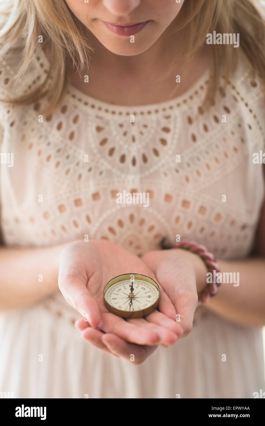 Woman holding navigation compass Stock Photo - Alamy