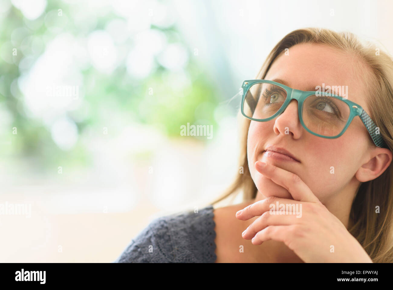 Woman looking up Stock Photo - Alamy