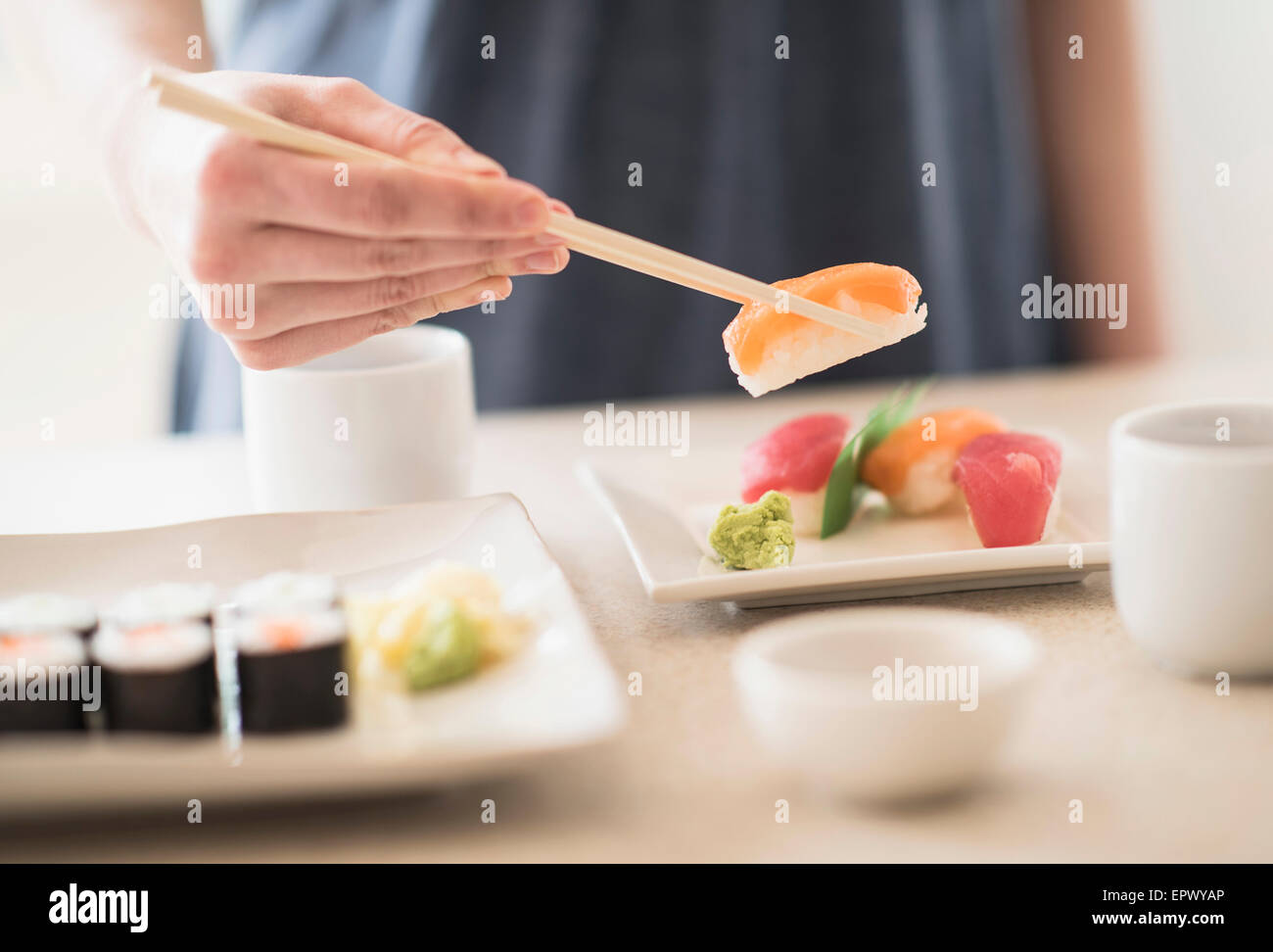 Woman preparing sushi hi-res stock photography and images - Alamy