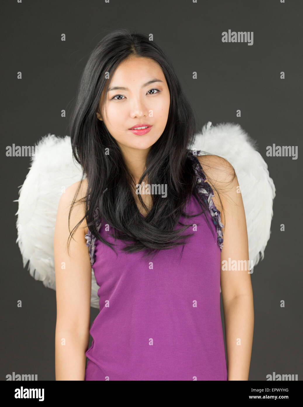 Attractive Asian young adult woman in angels and demon Stock Photo - Alamy