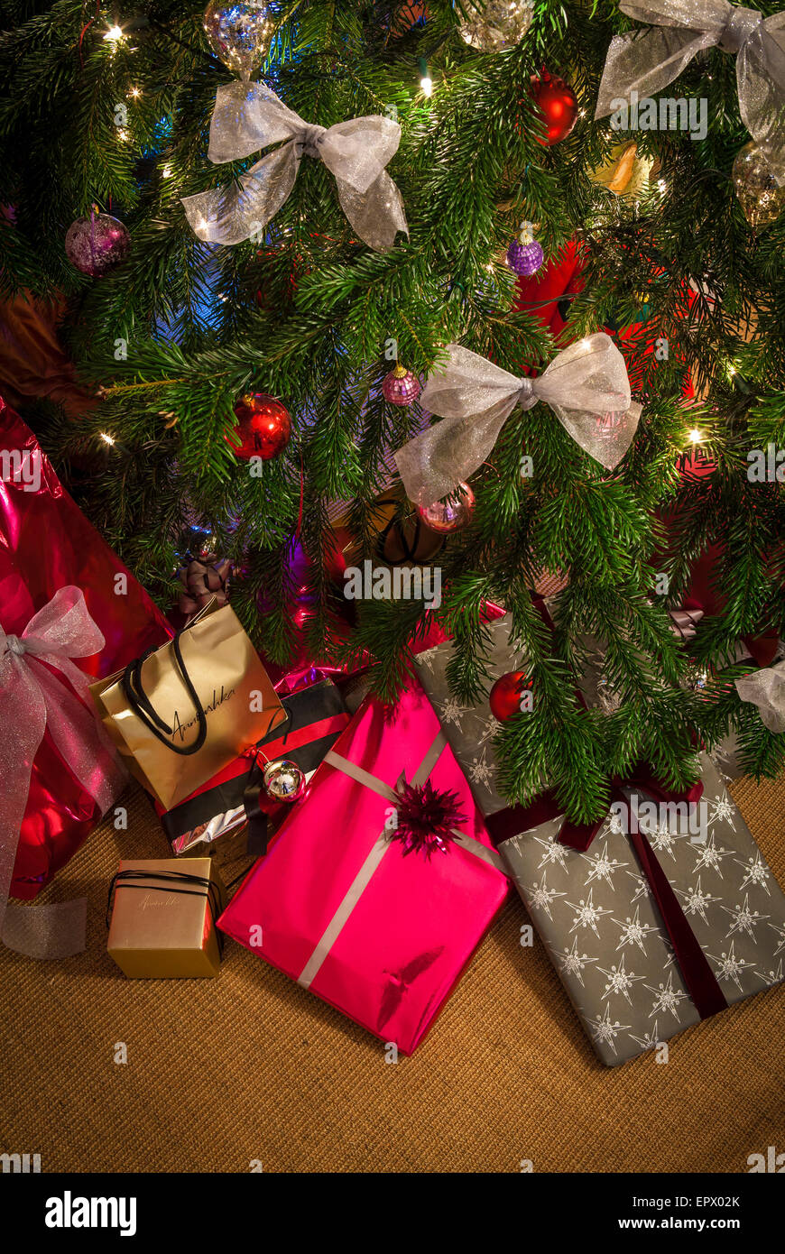 Christmas presents under tree in Chichester home, England, UK Stock ...