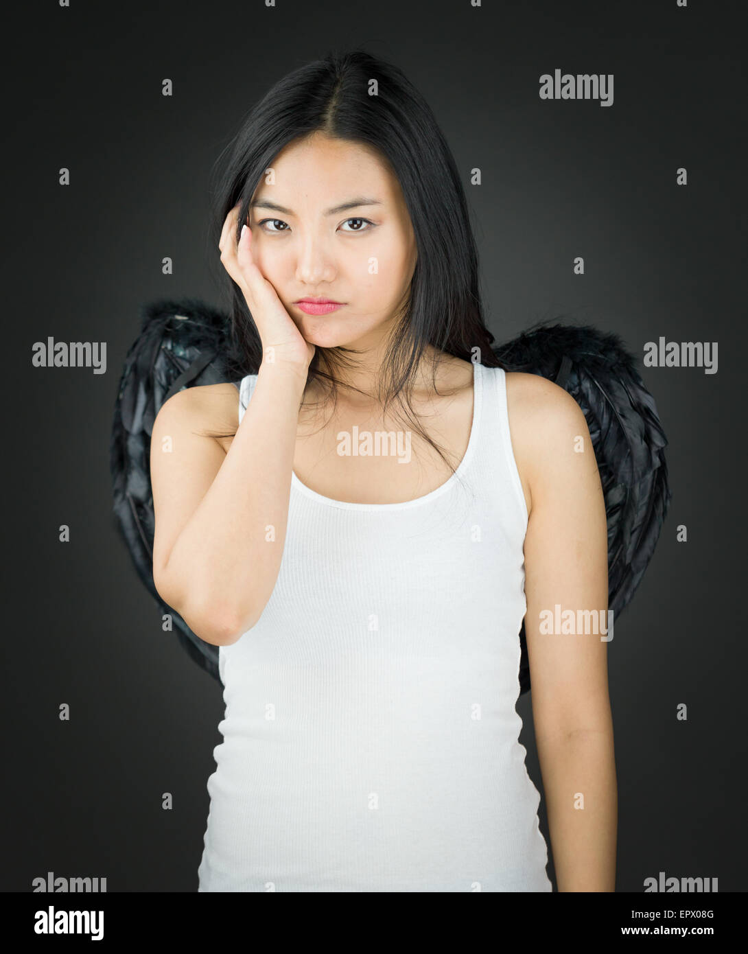 Attractive Asian young adult woman in angels and demon Stock Photo - Alamy