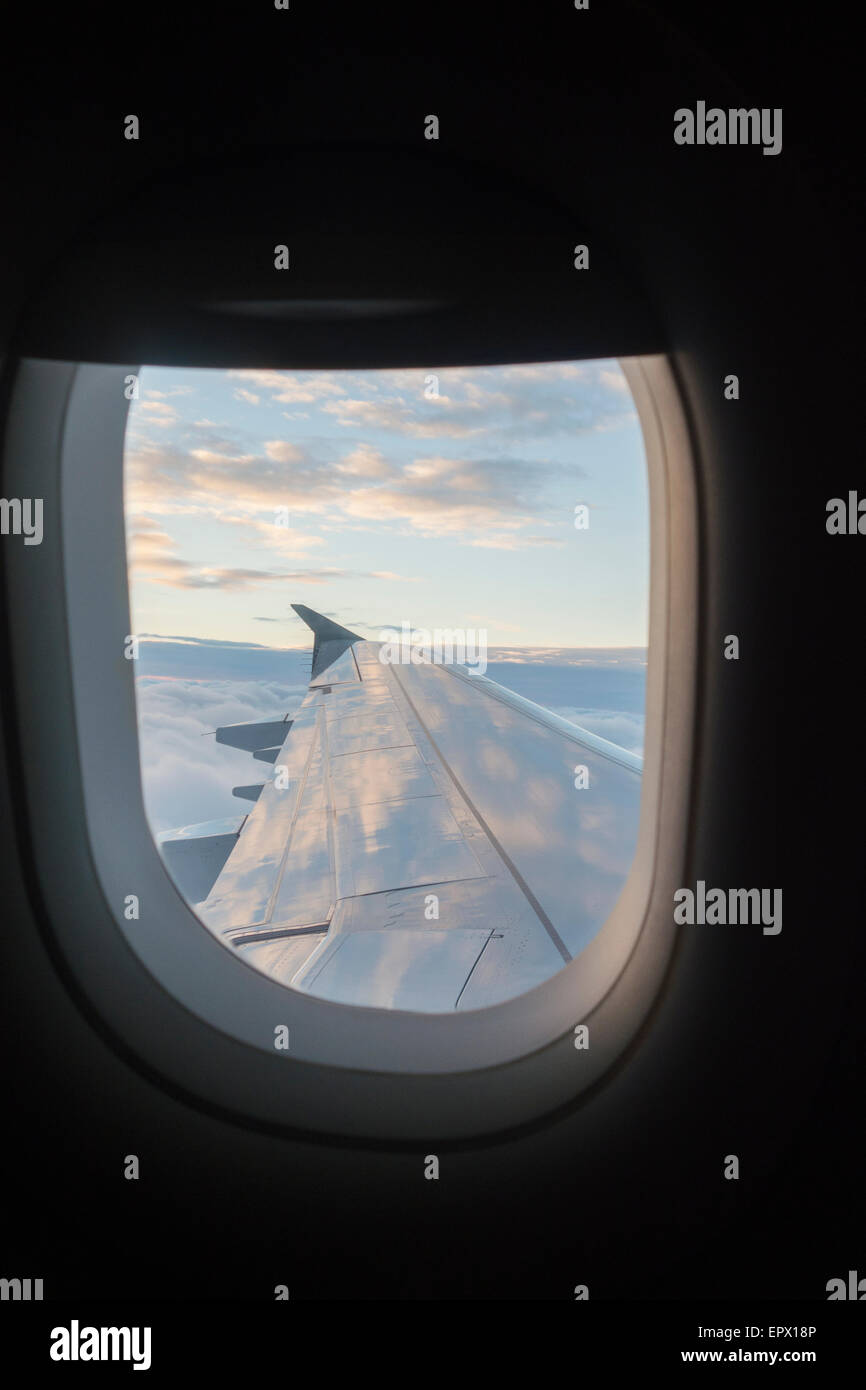 Wing of airplane seen through airplane window Stock Photo - Alamy