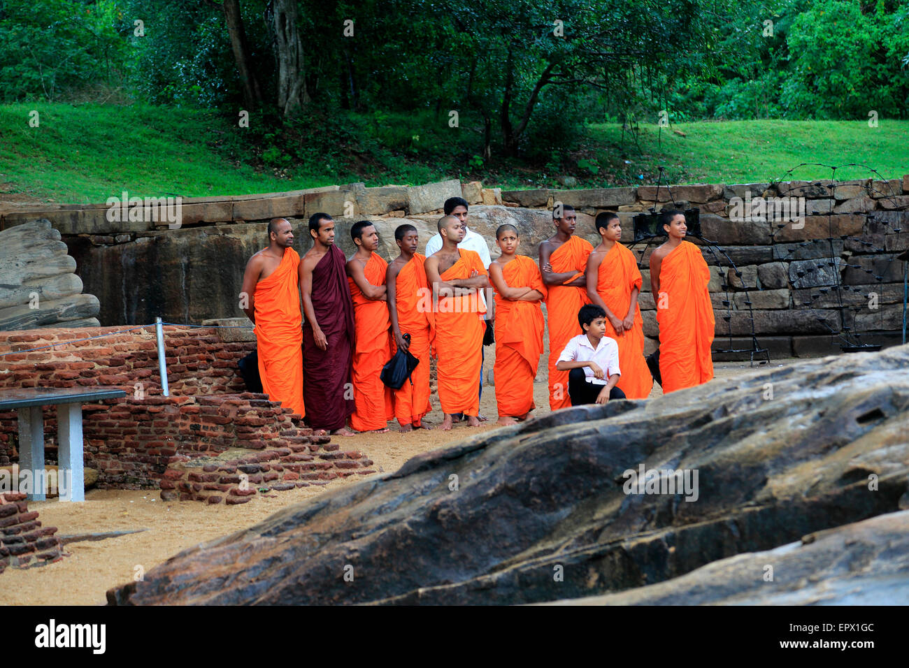 Orange robed monks, Gal Viharaya, UNESCO World Heritage Site, the ...
