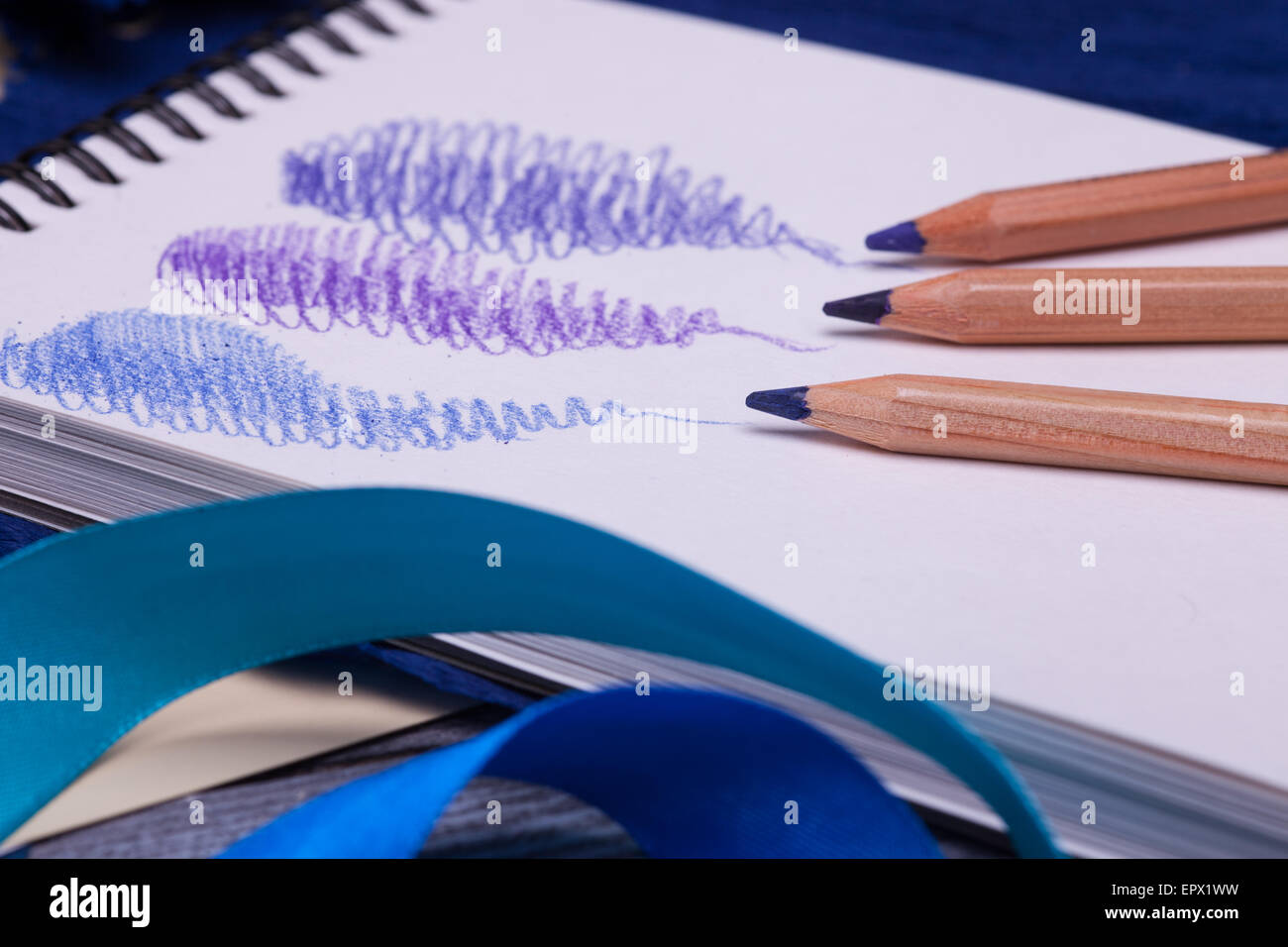 three watercolor pencils on a white note Stock Photo - Alamy