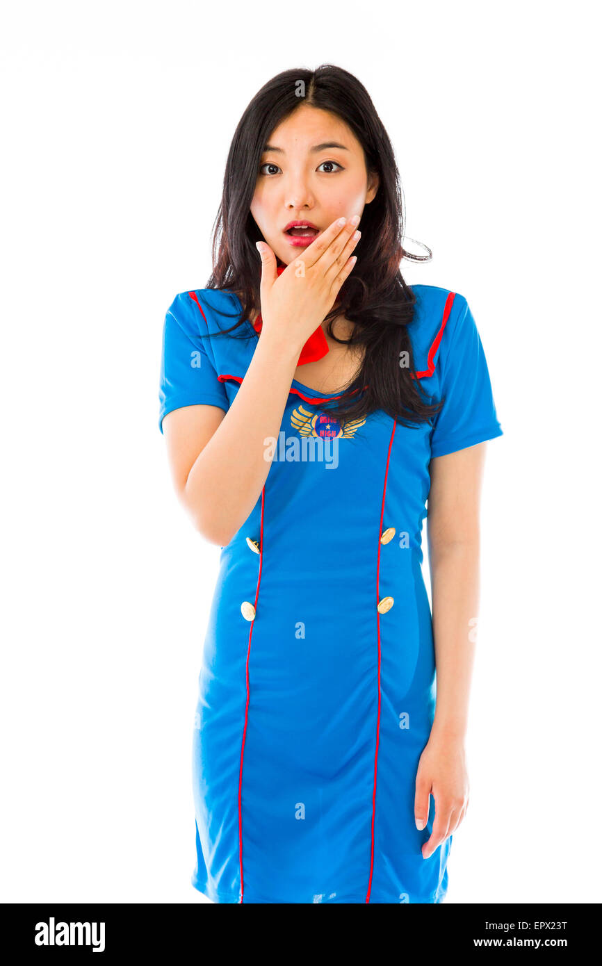 Shocked Asian air stewardess with hand over mouth isolated on white ...