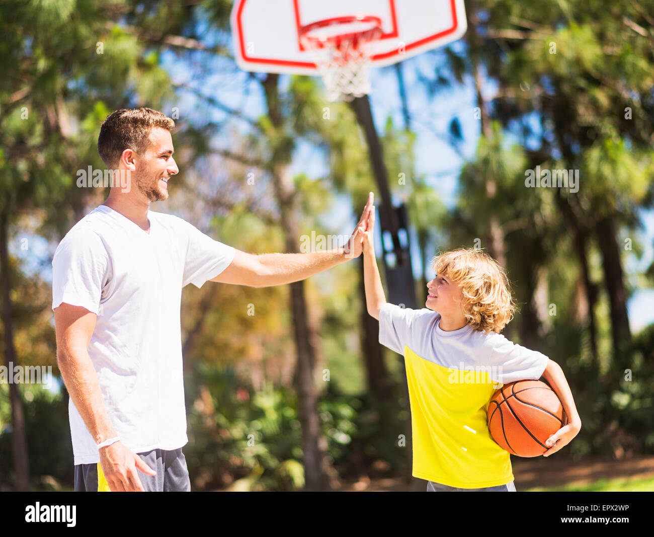 Boys high fiving hi-res stock photography and images - Alamy