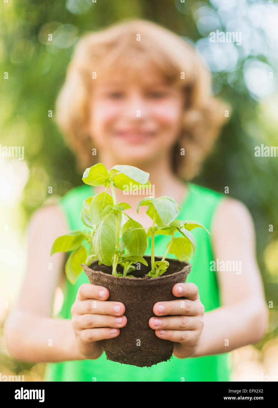 Boy plant pot hi-res stock photography and images - Alamy