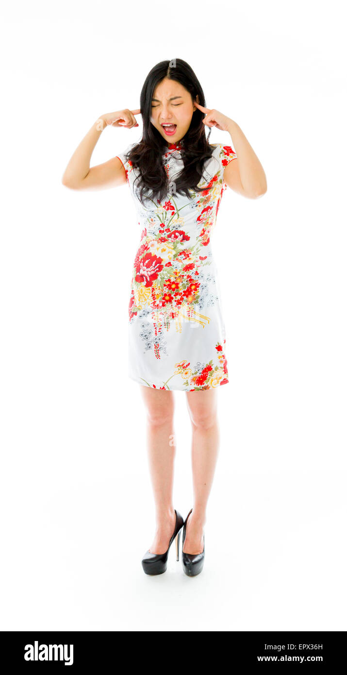 Asian young woman shouting with hands in ear Stock Photo - Alamy