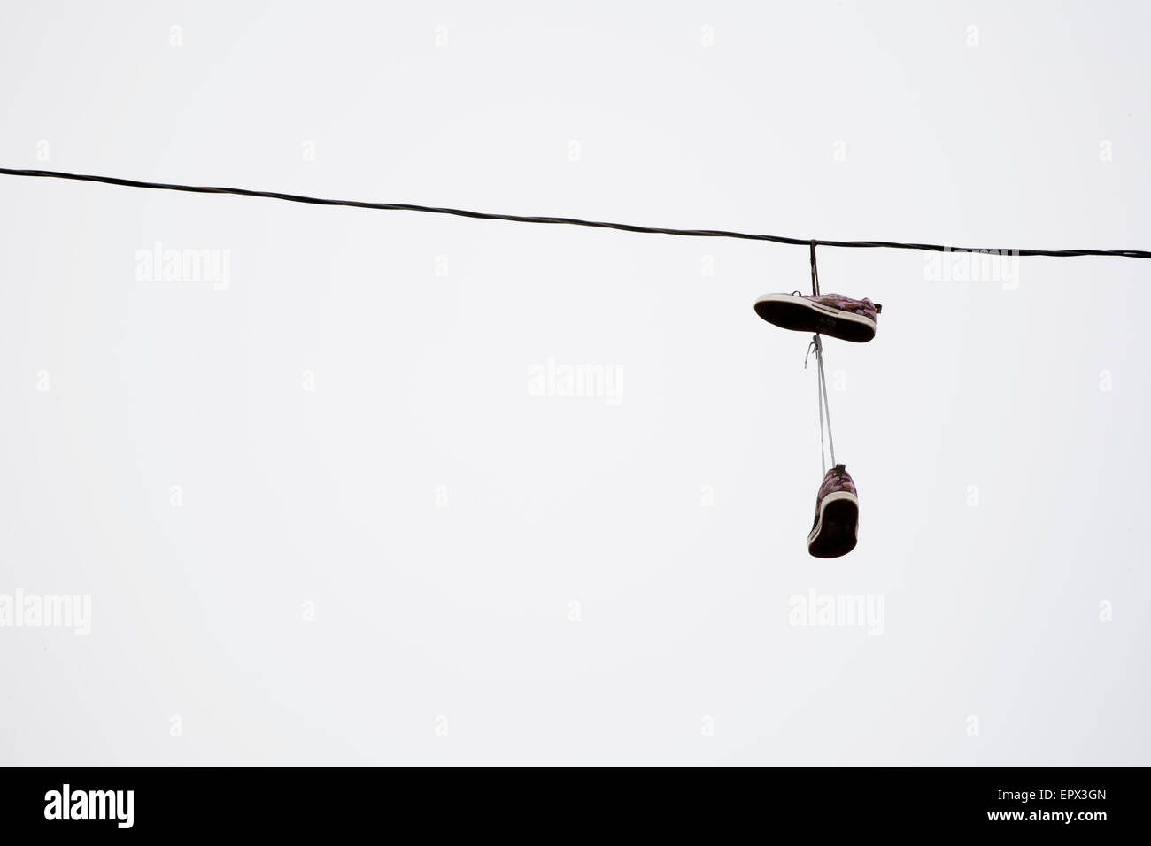 Hanging from power lines hi-res stock photography and images - Alamy