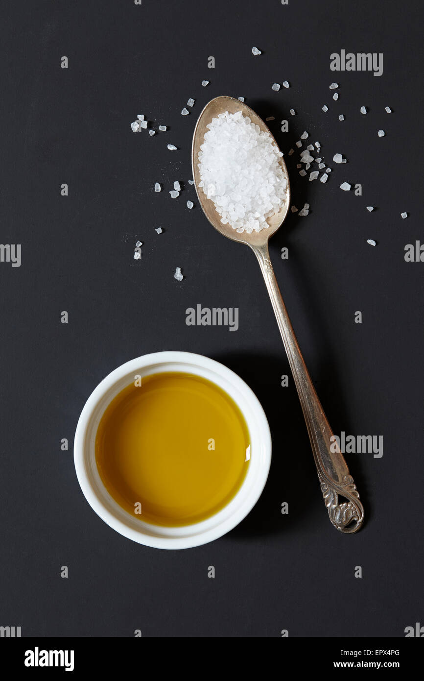 Olive oil and salt on black background Stock Photo - Alamy