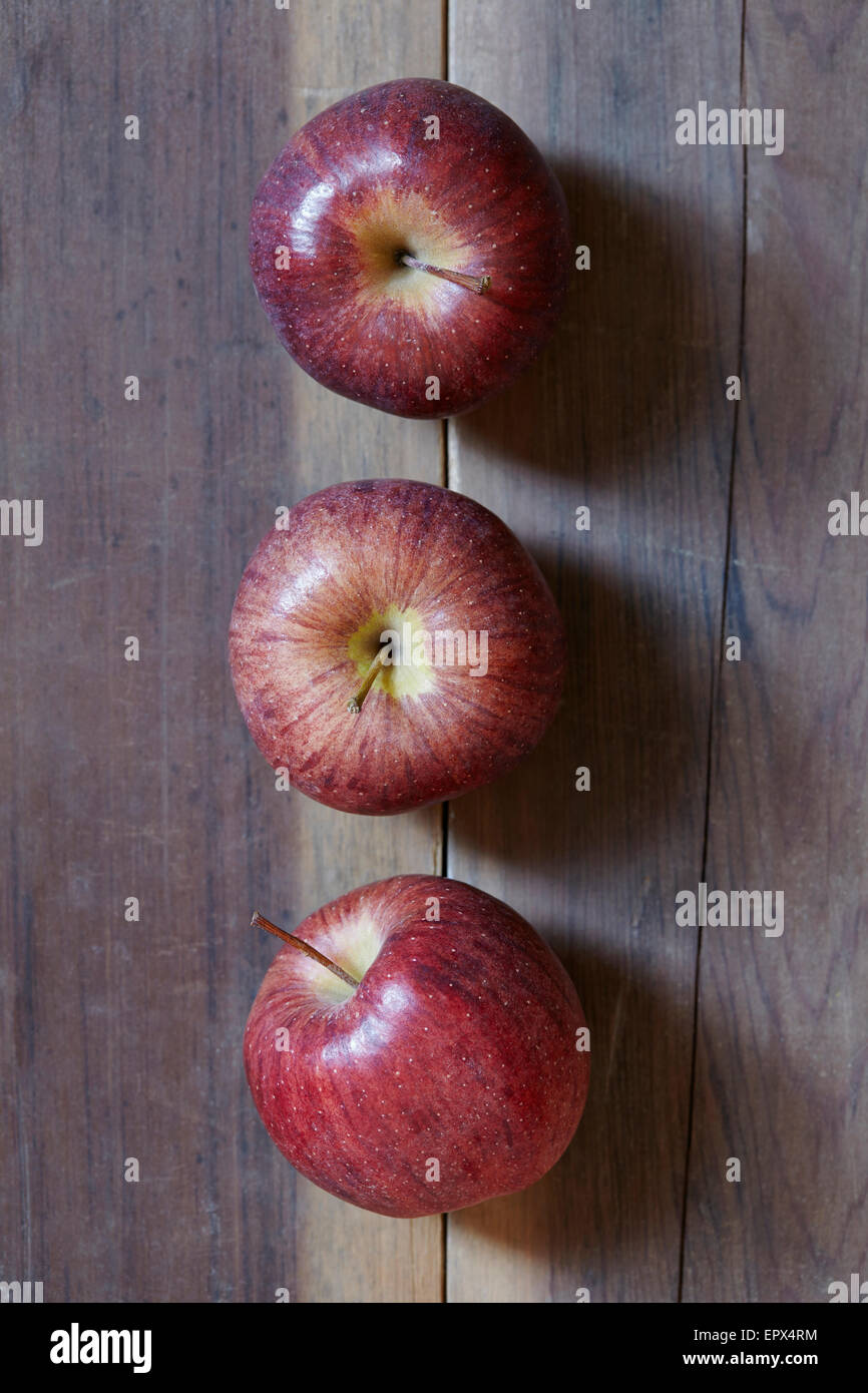 Three apples in row Stock Photo - Alamy