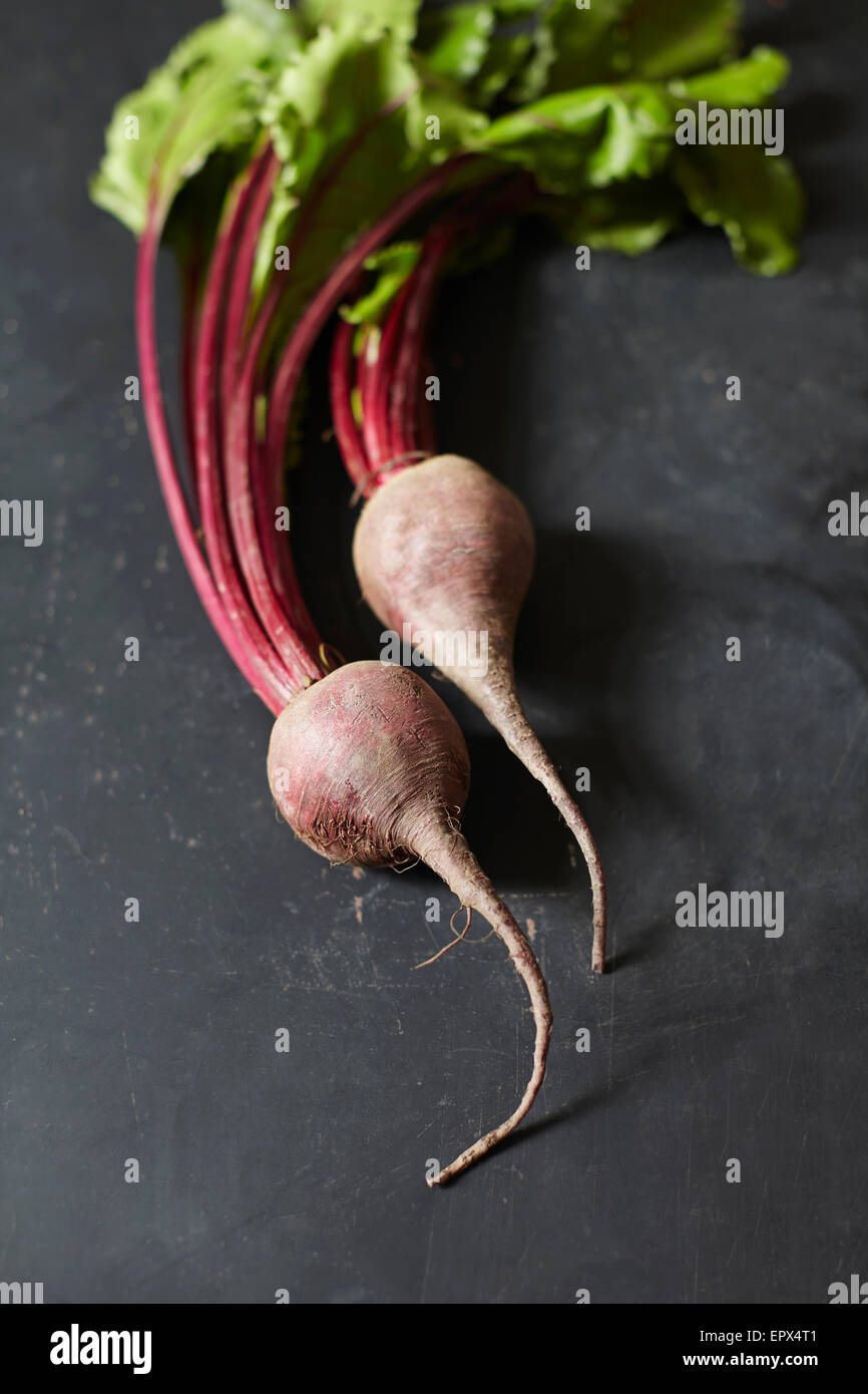 Two beets on black background Stock Photo - Alamy