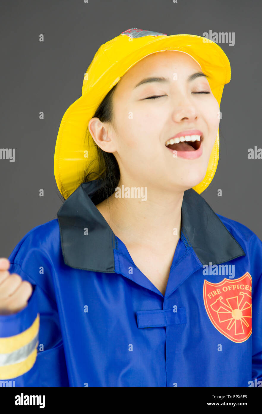 Happy and joyful lady firefighter celebrating success Stock Photo - Alamy