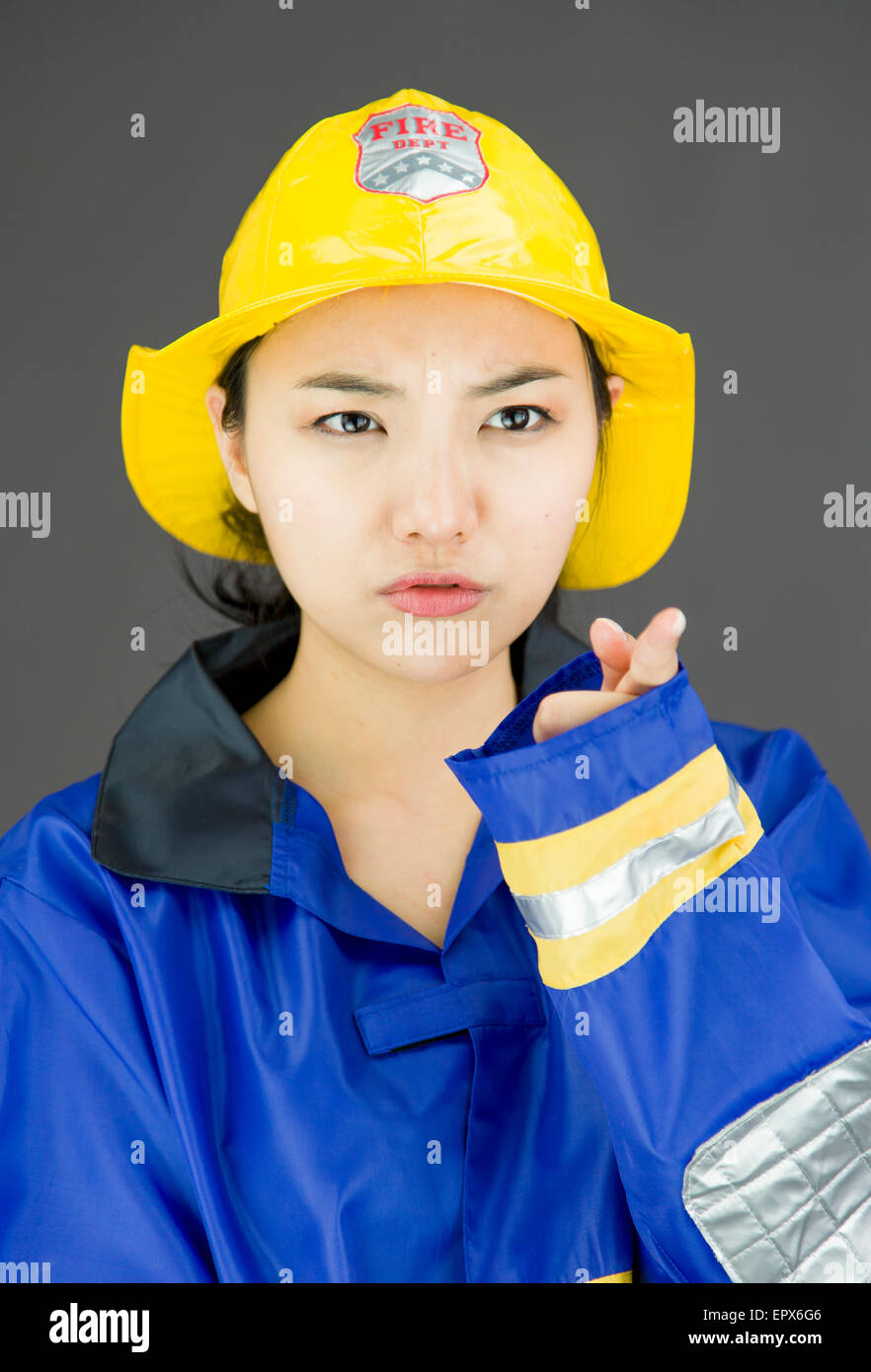 Close up of a angry lady firefighter pointing somebody Stock Photo - Alamy
