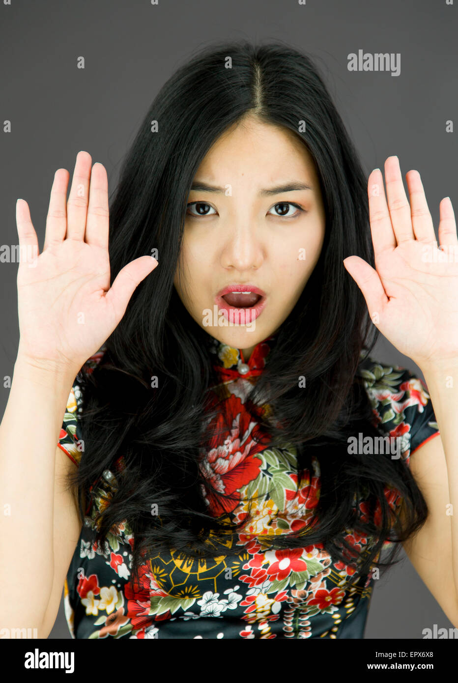 Asian young woman making stop gesture and showing stop Stock Photo - Alamy
