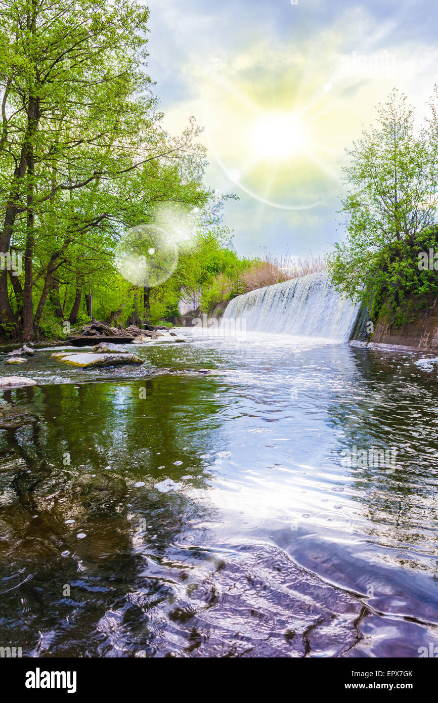 summer landscape waterfall flows into the river Stock Photo - Alamy
