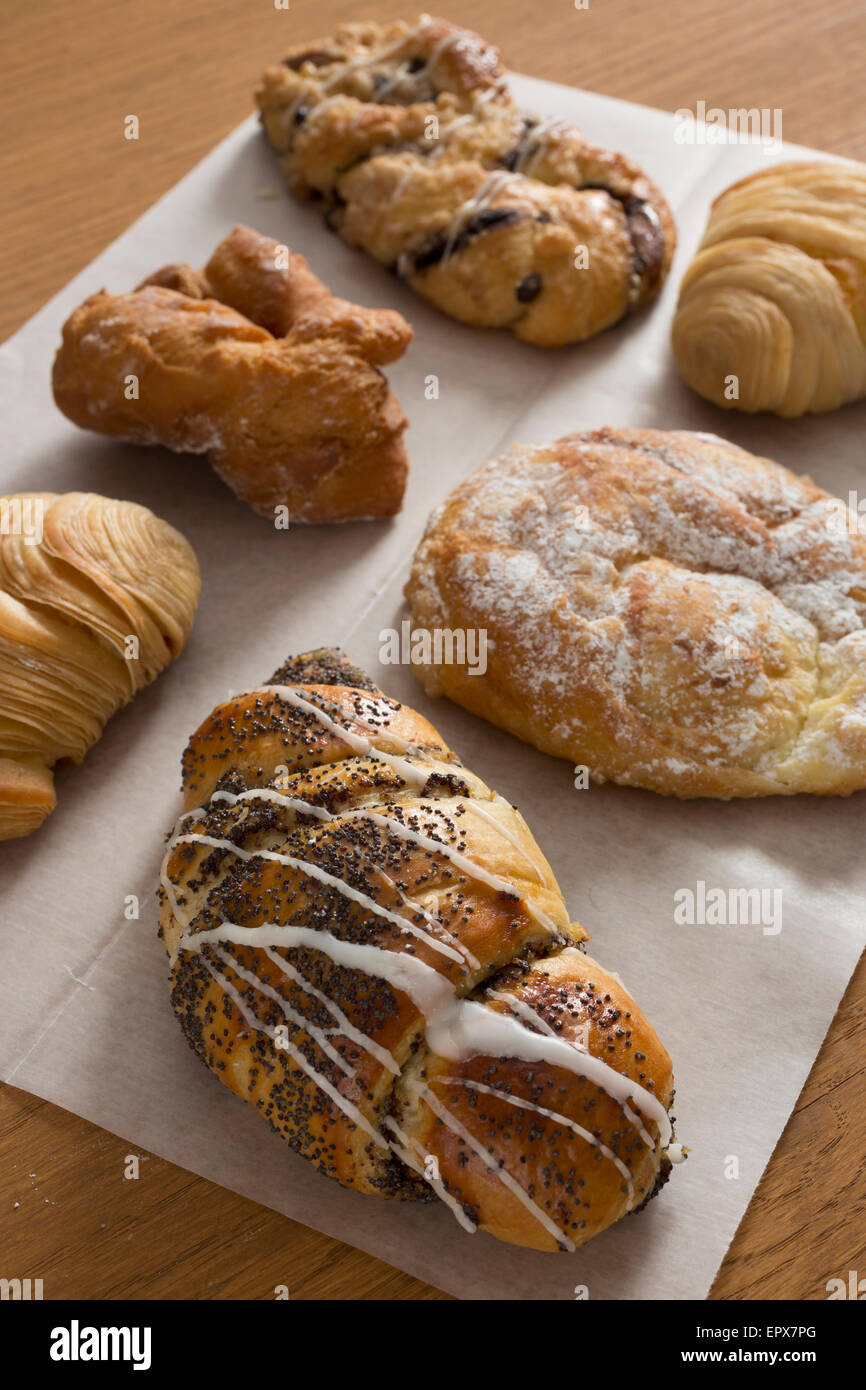 Assorted pastries on waxed paper Stock Photo - Alamy