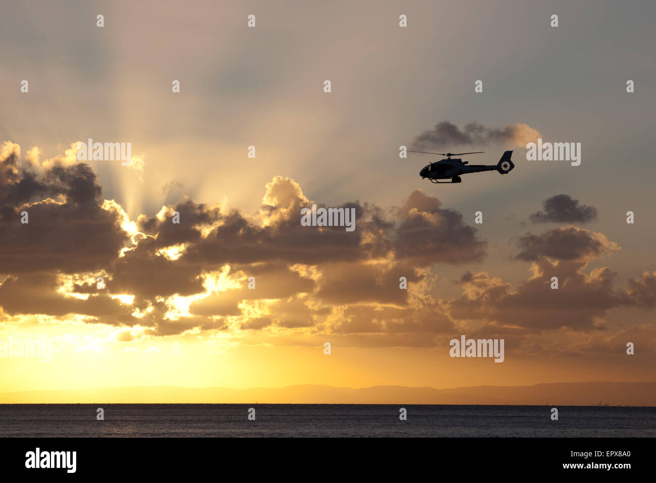 Helicopter silhouette sun flying hi-res stock photography and images ...
