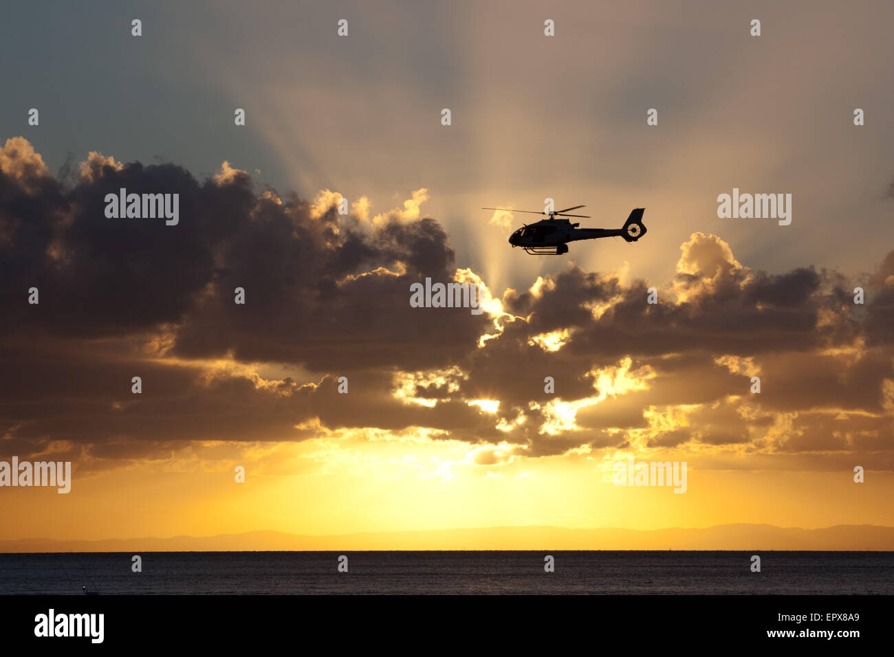 Helicopter and sunset Stock Photo - Alamy