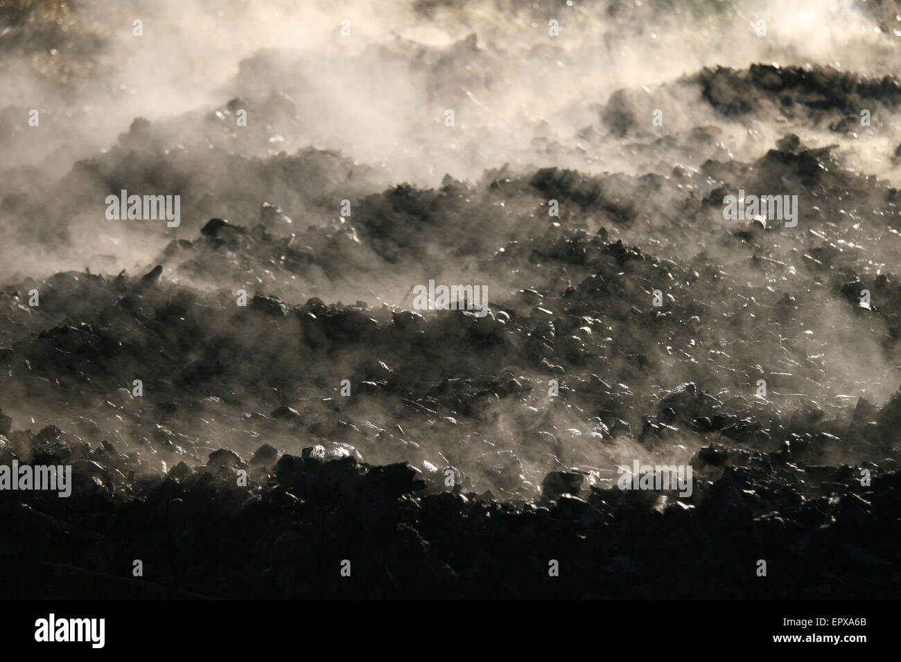 Smoldering coal and ash from a backyard fire Stock Photo - Alamy