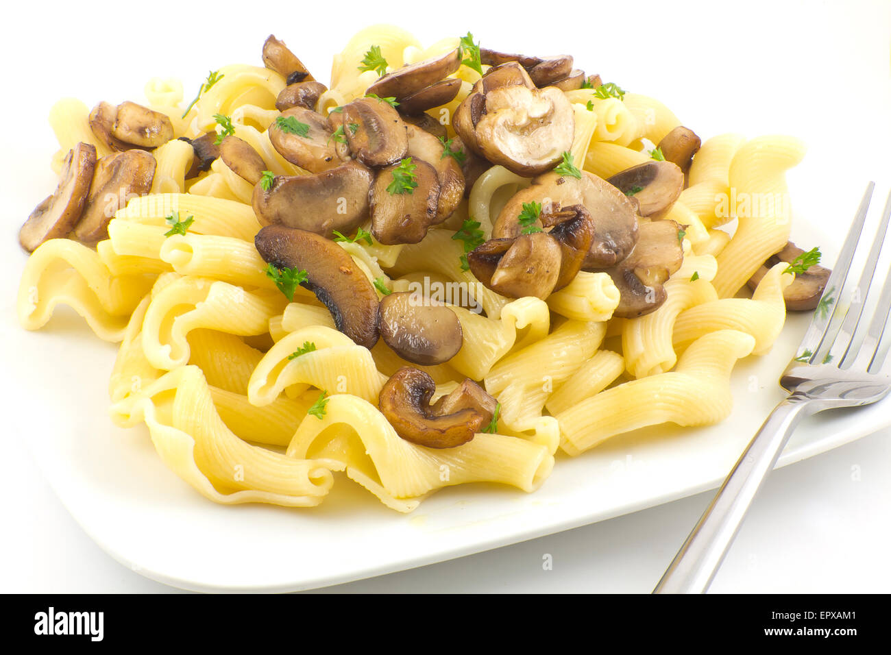 Gigli Con Funghi pasta dish with chopped parsley leaves Stock Photo - Alamy