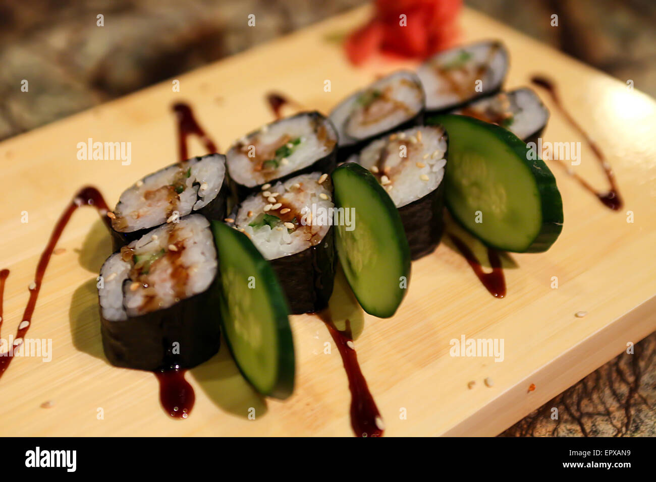 Delicious Unagi maki sushi rolls served with a wood plate Stock Photo ...